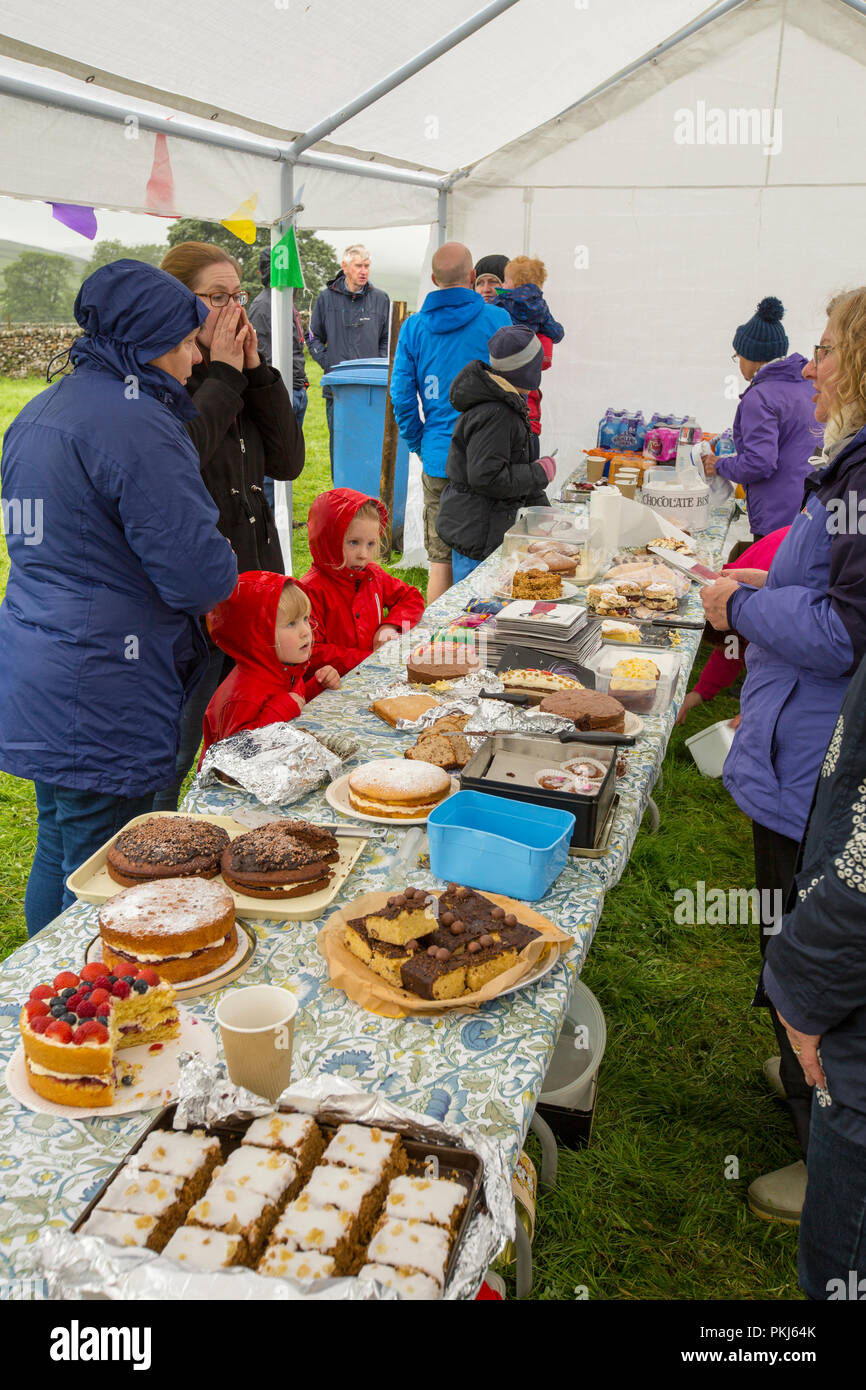 A cake stall at a very wet Halton Gill Gala in littondale, Yorkshire ...
