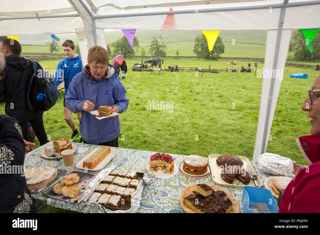 A cake stall at a very wet Halton Gill Gala in littondale, Yorkshire ...