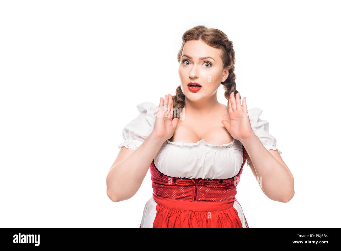 shocked oktoberfest waitress in traditional bavarian dress gesturing by ...