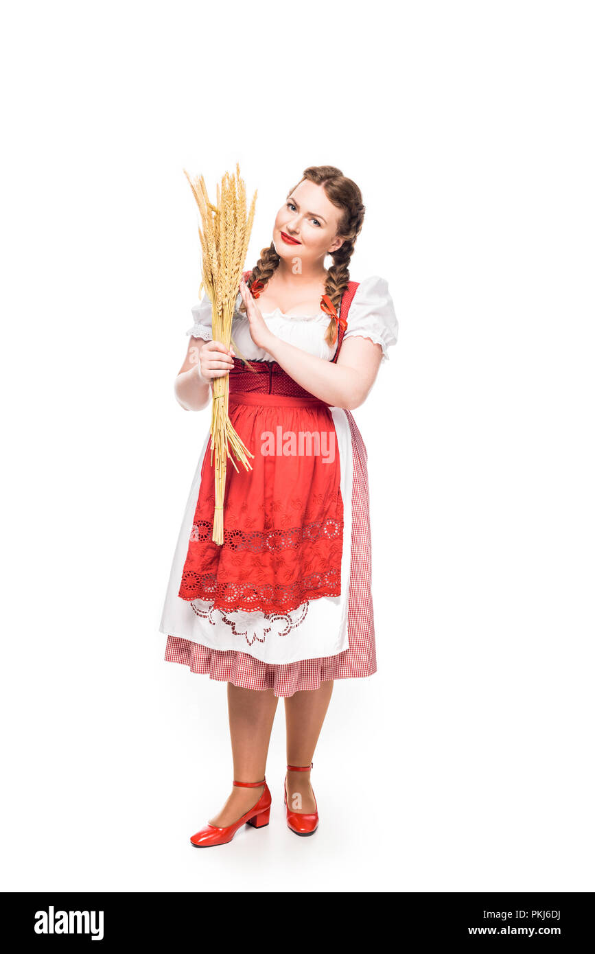 attractive oktoberfest waitress in traditional bavarian dress holding ...