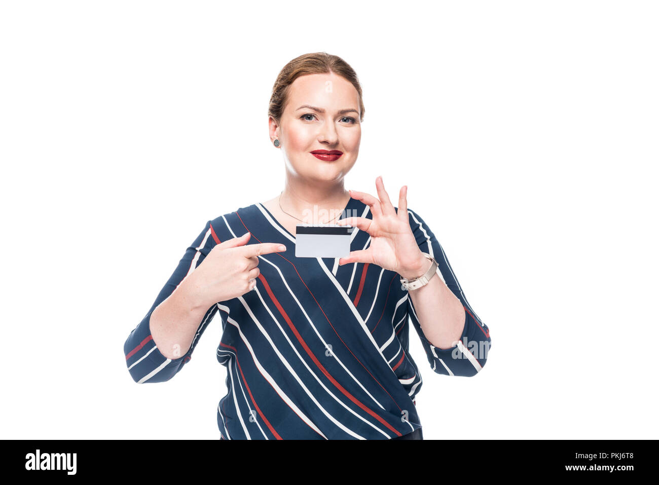 smiling businesswoman pointing by finger at credit card isolated on ...
