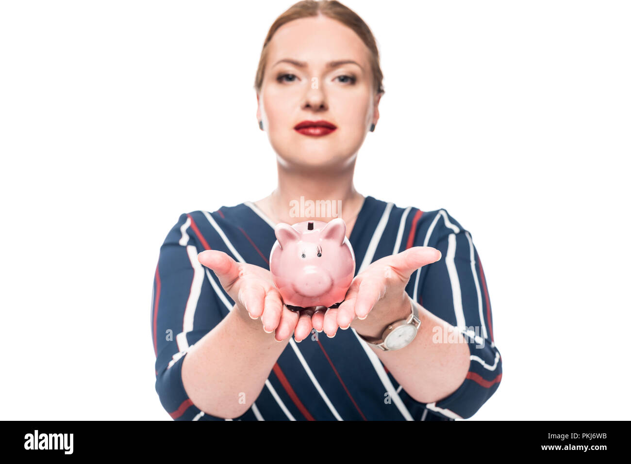 beautiful female accountant showing pink piggy bank isolated on white ...