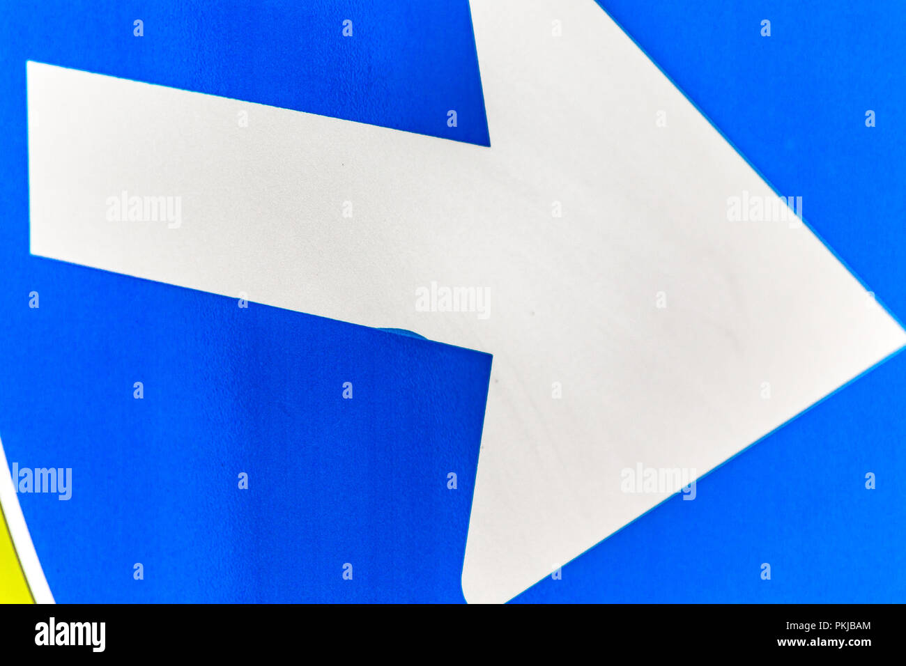 closeup of traffic arrow sign, white arrow on blue road sign Stock ...