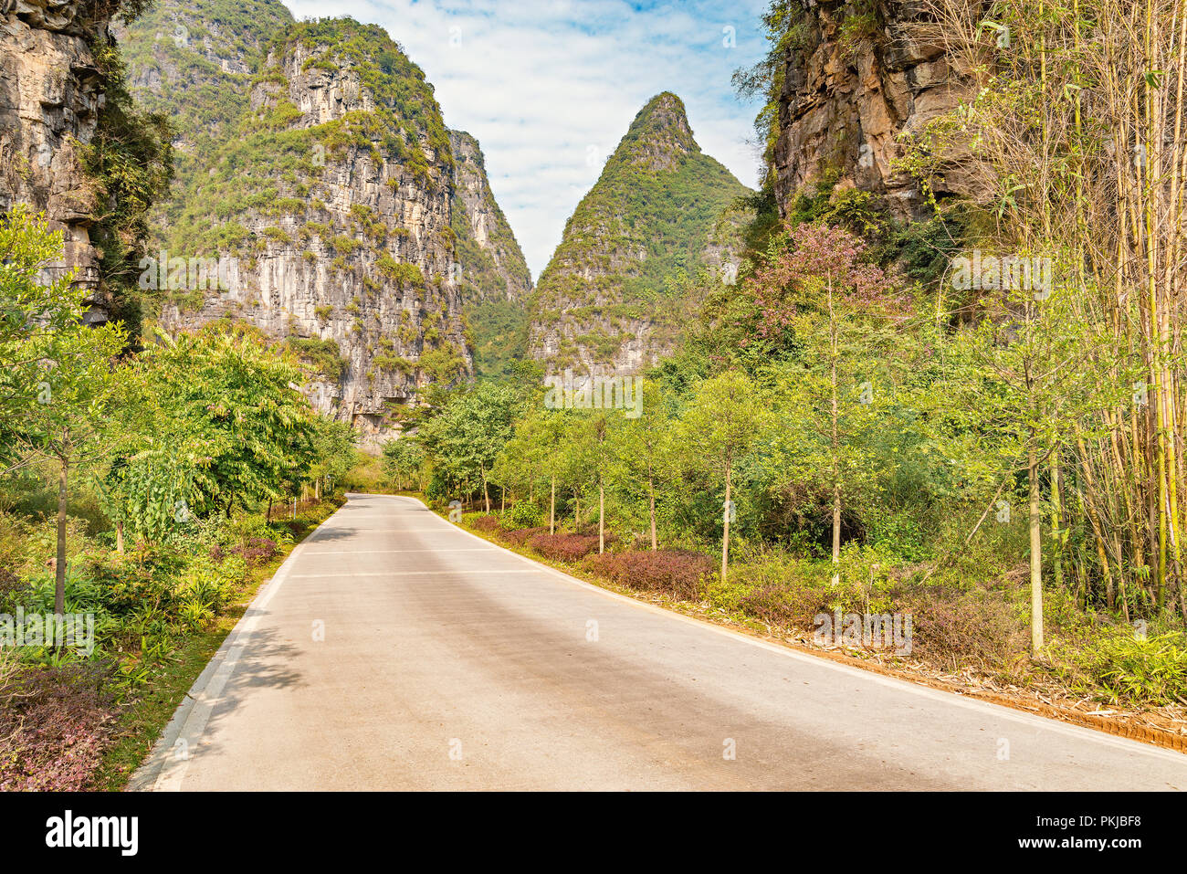 Road between the karst mountains near Yangshuo. Guangxi Province. China ...