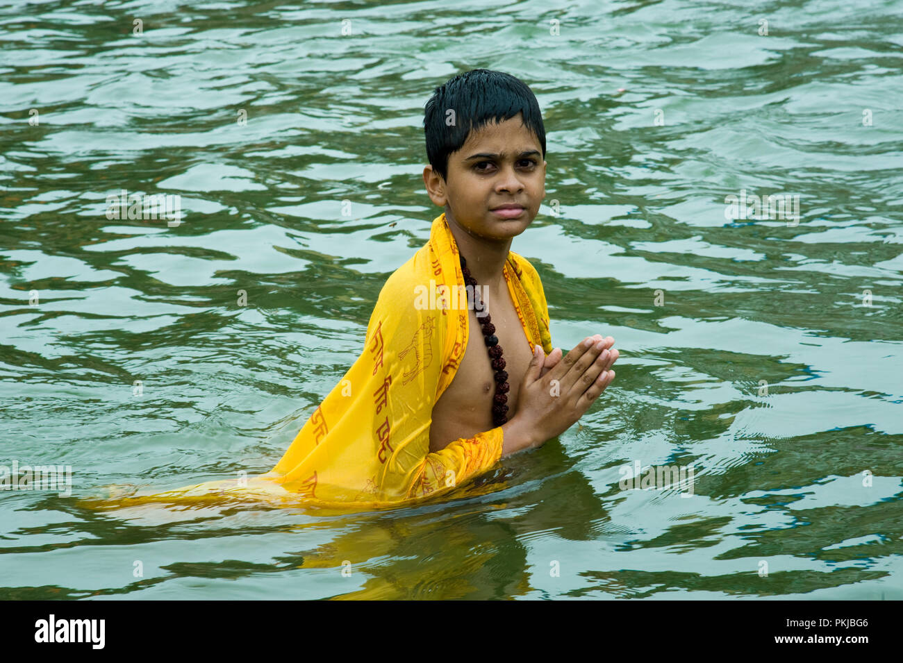 Hindu Child Sadhu praying after a holy dip at Panchavati ram kund in ...