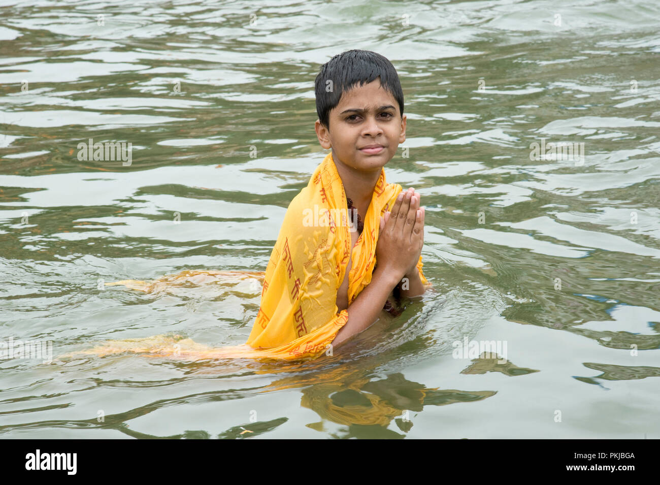 Hindu Child Sadhu praying after a holy dip at Panchavati ram kund in ...