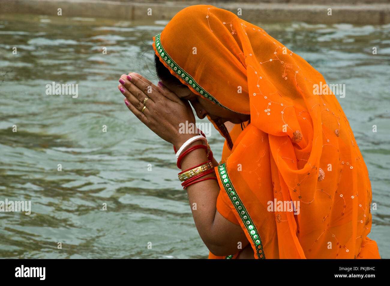Woman offering prayers hi-res stock photography and images - Alamy