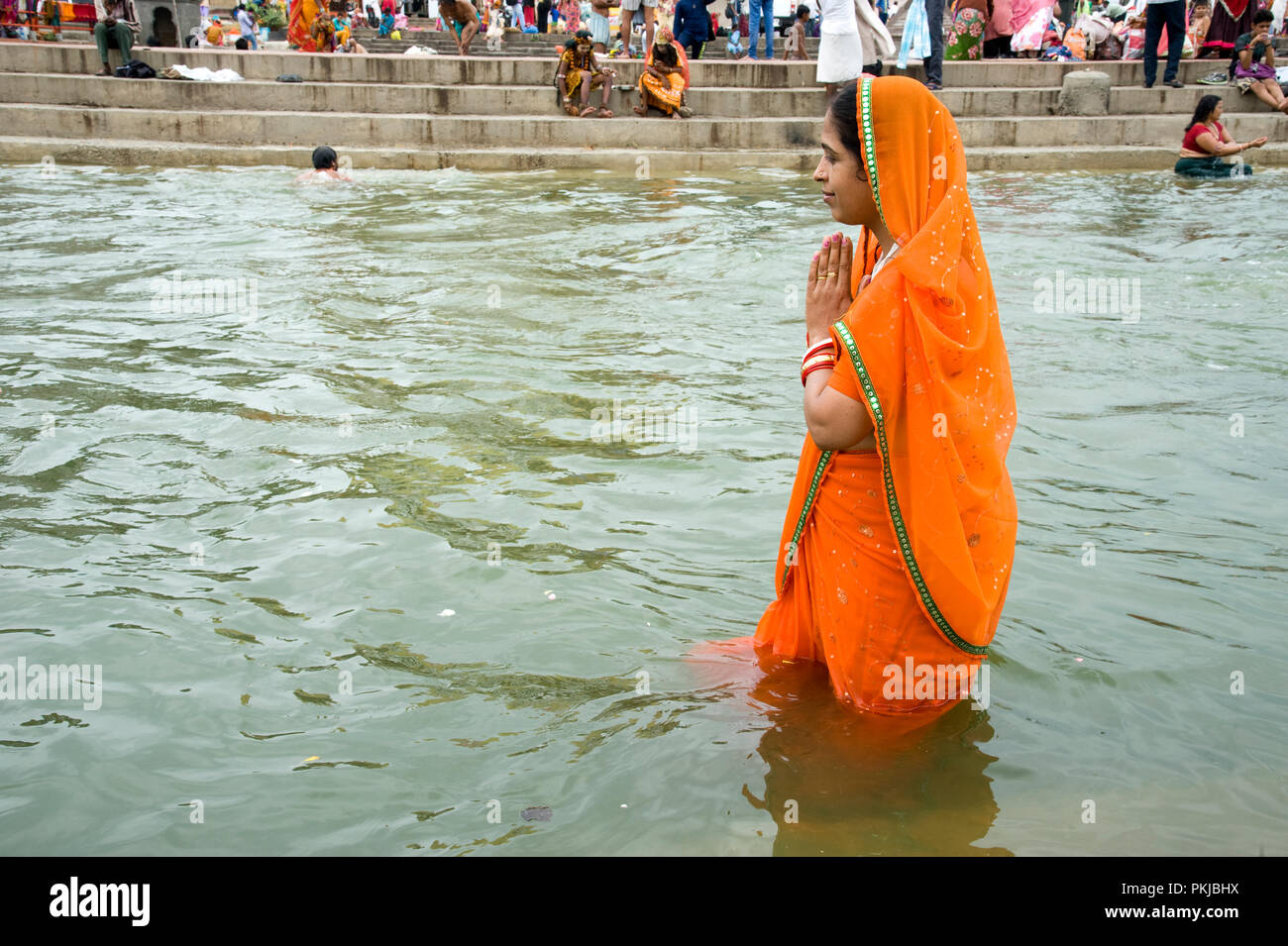 Hindu devotees offering prayers hi-res stock photography and images - Alamy