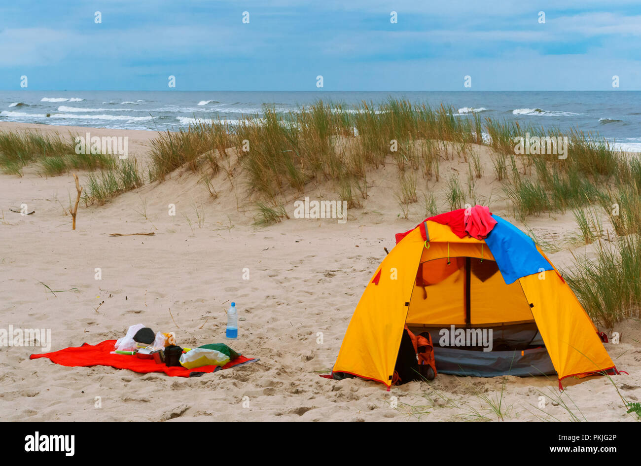 tourist tent yellow on the sand, tent and things on the beach Stock ...