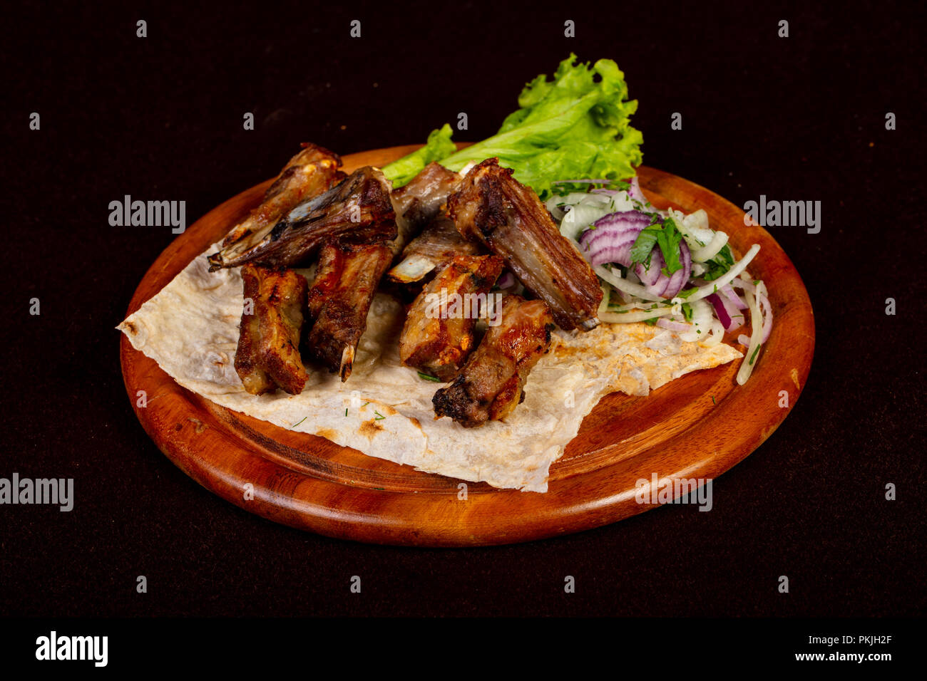 Grilled Mutton ribs with onion Stock Photo - Alamy