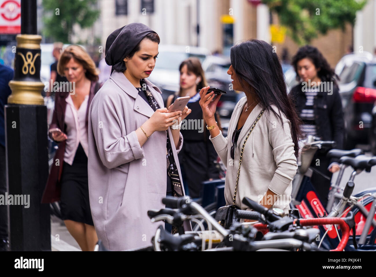 People using mobile devices out on the street, City of Westminster ...