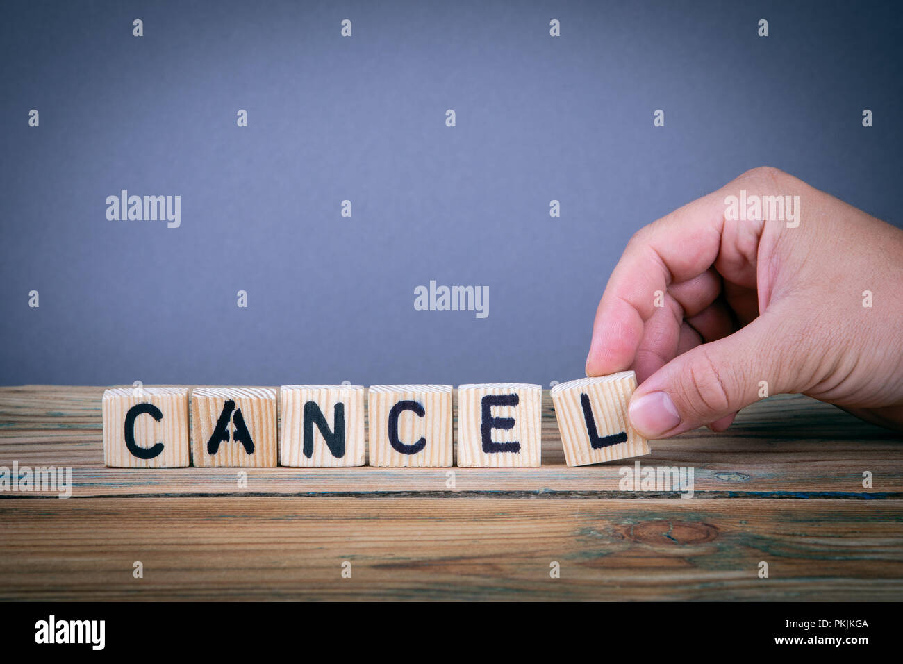cancel, wooden letters on the office desk Stock Photo - Alamy