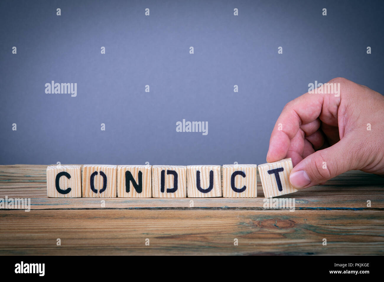 conduct, wooden letters on the office desk Stock Photo - Alamy