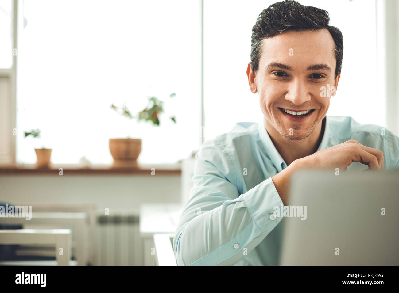 Smart skilled young programmer doing his job Stock Photo - Alamy