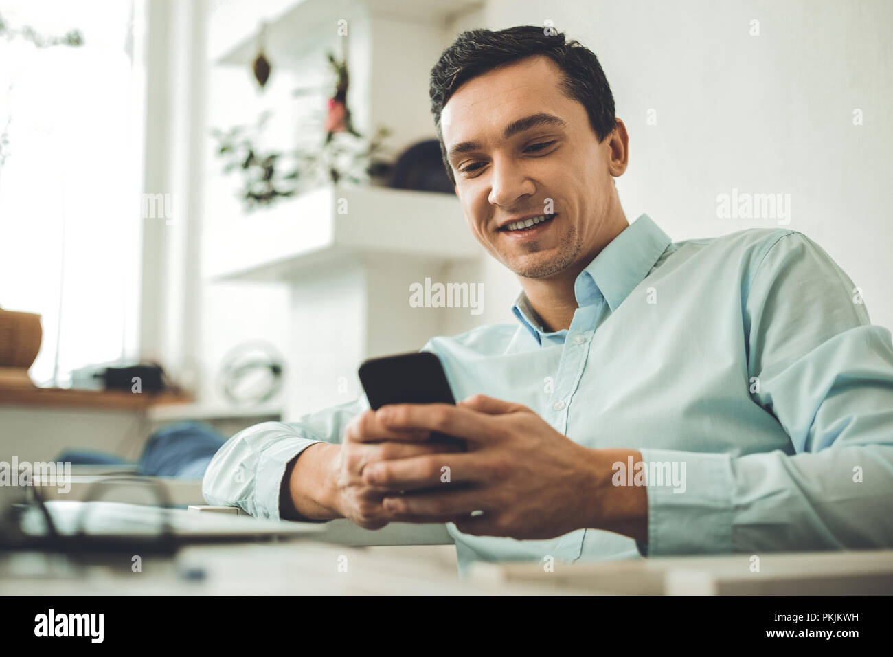 Delighted happy man typing hi-res stock photography and images - Alamy