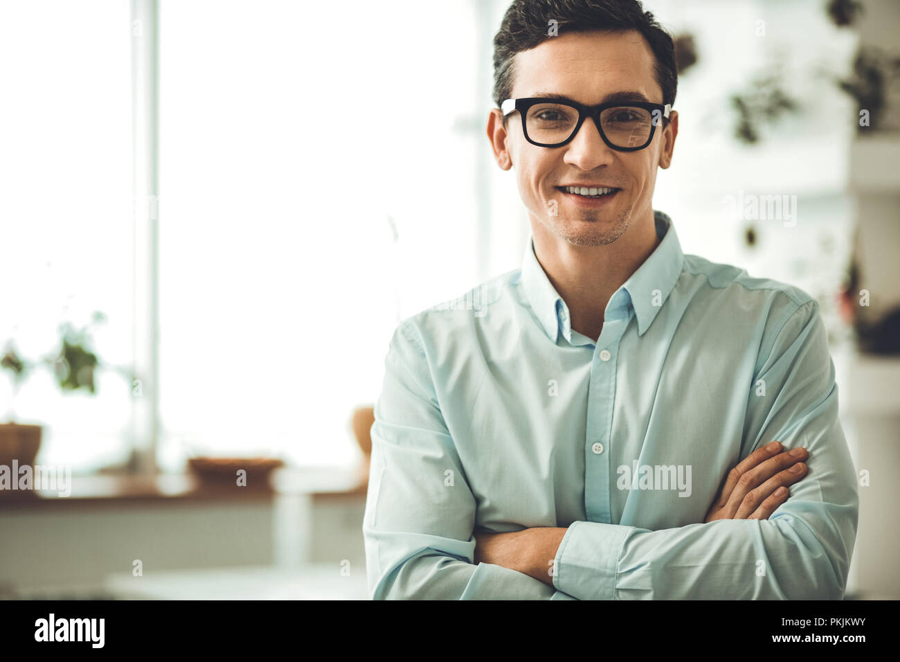 Positive smart man looking at you with delight Stock Photo - Alamy