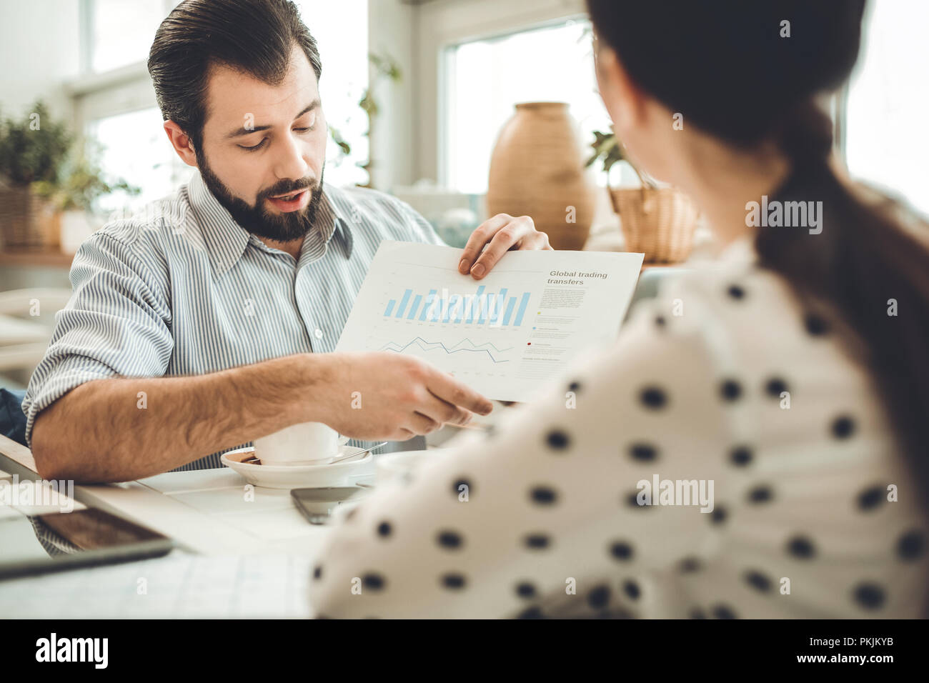 Smart nice young man presenting his project Stock Photo - Alamy