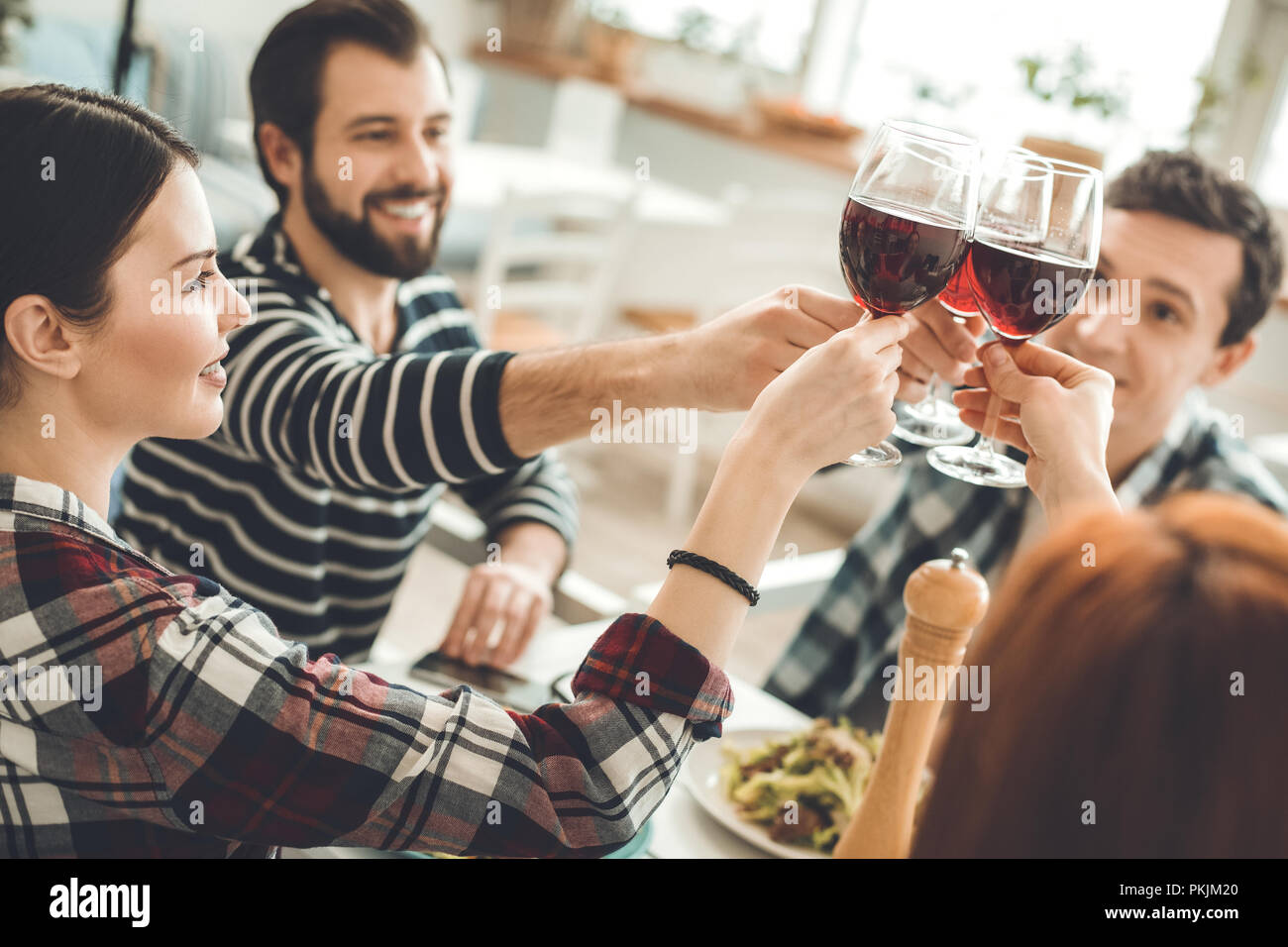 Positive happy people cheering with wine happily Stock Photo - Alamy