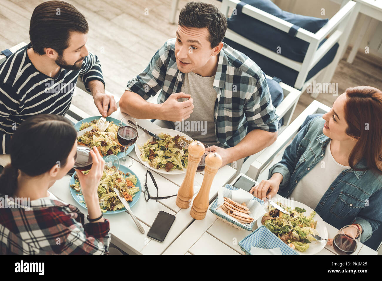 Positive joyful people talking to each other Stock Photo - Alamy