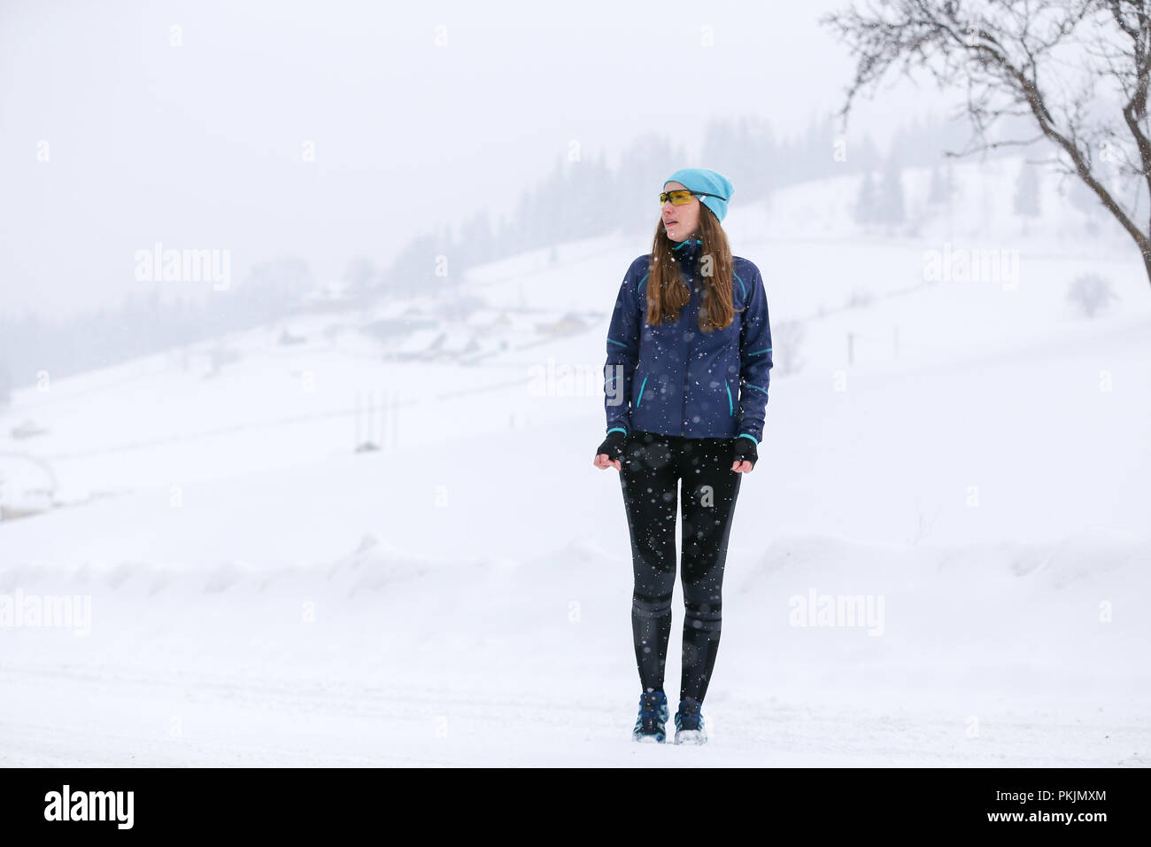 Young runner woman standing in park in winter Stock Photo - Alamy