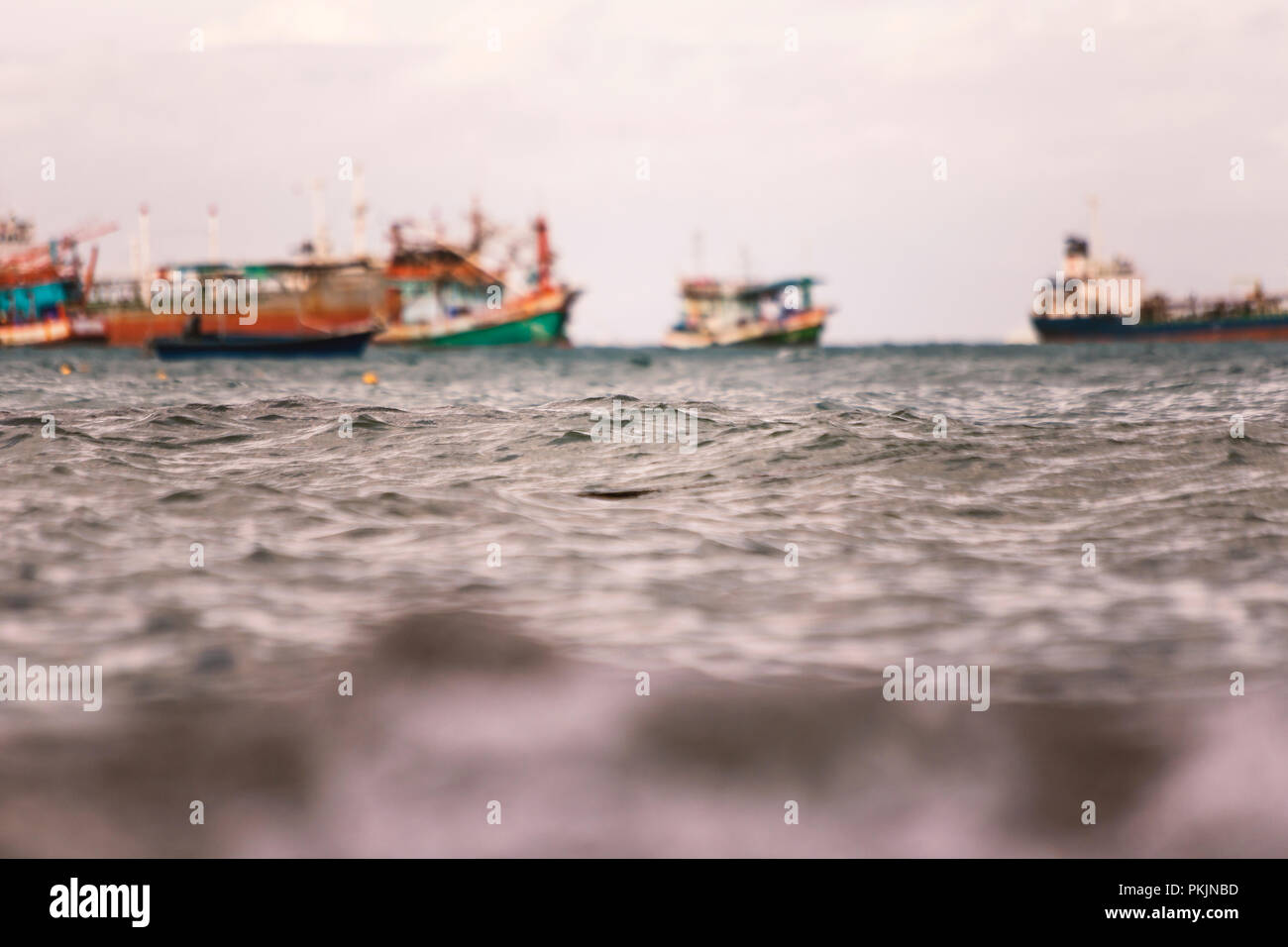 Blurred of fishing boat float in the sea Stock Photo - Alamy