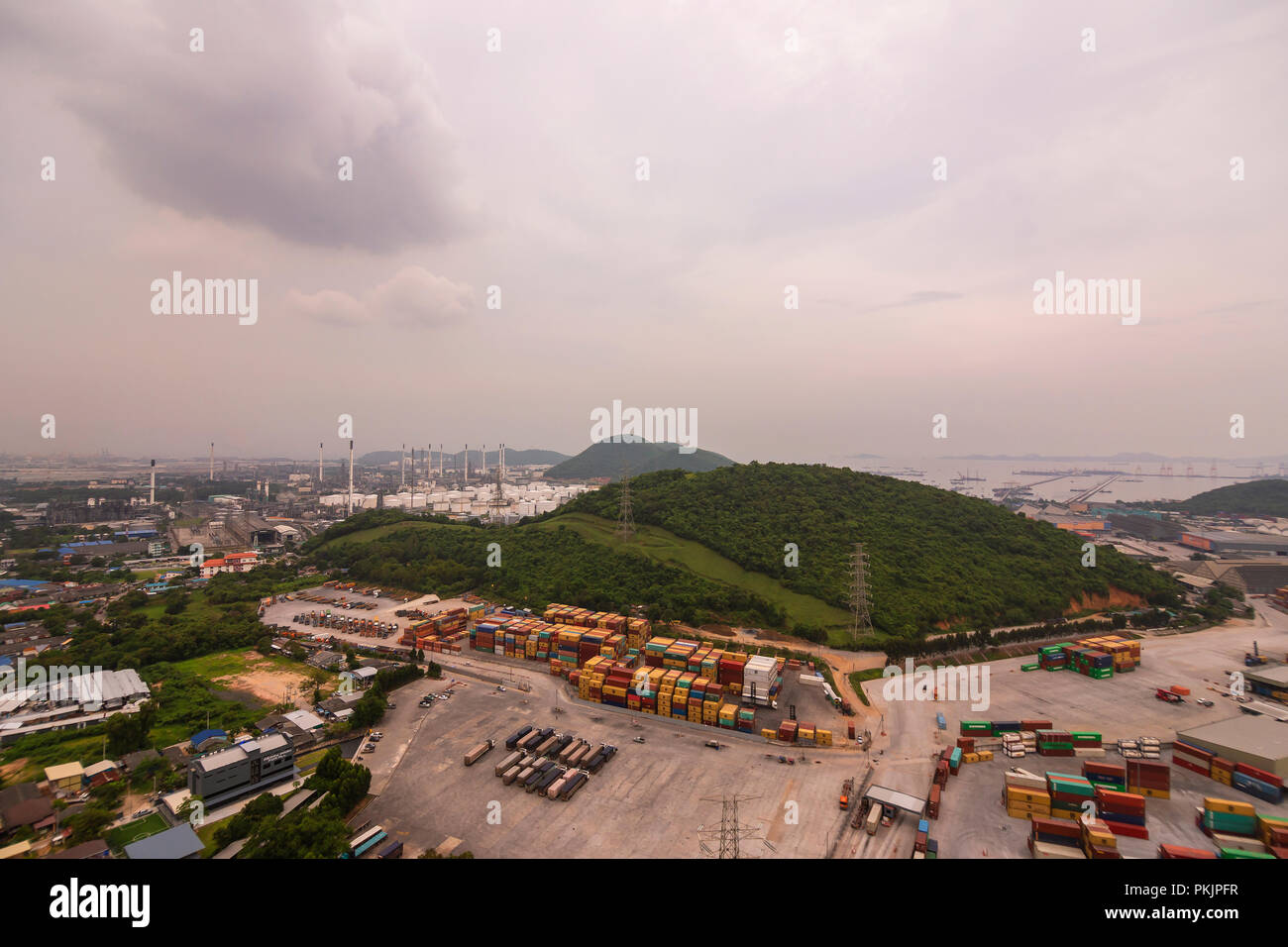 Landscape view of cargo and container field and small hill Stock Photo ...