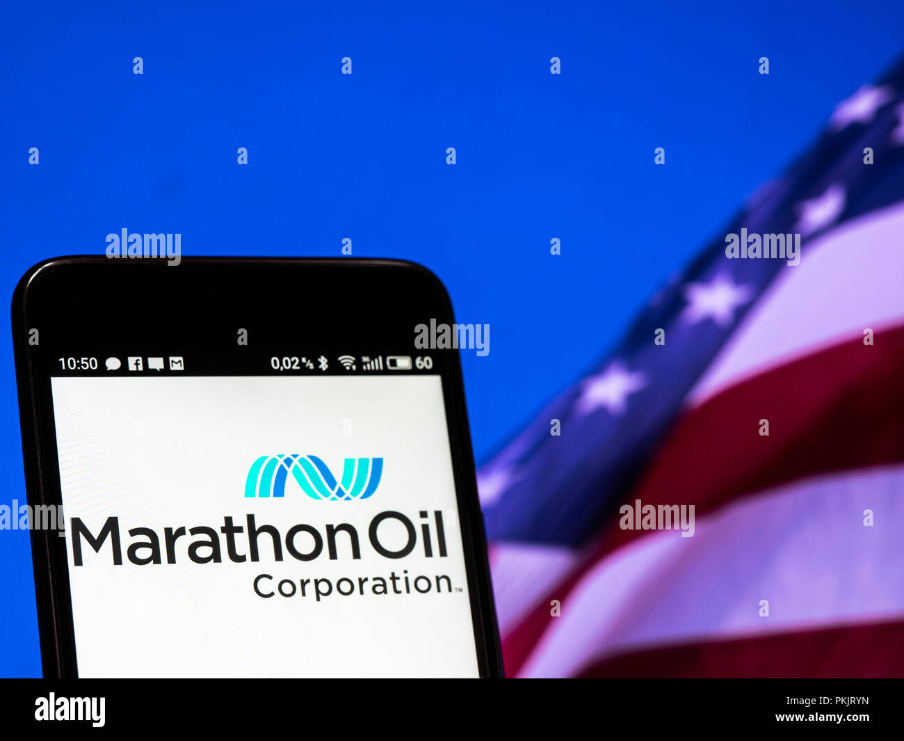 Marathon Oil Corporation logo seen displayed on smart phone Stock Photo ...