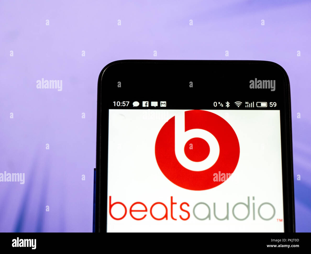 Beats Electronics LLC logo seen displayed on smart phone Stock Photo ...