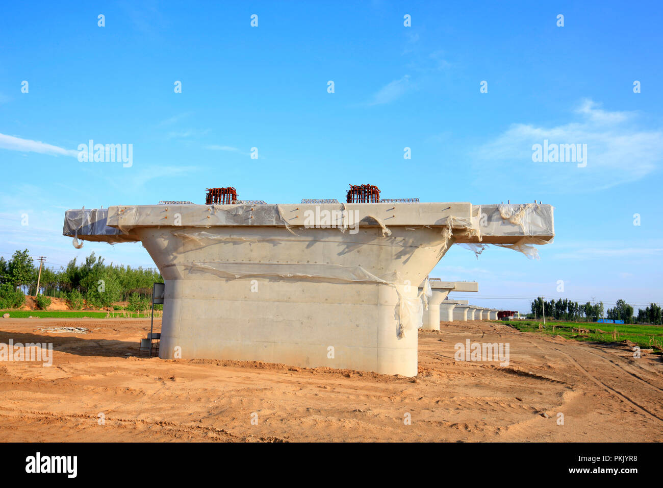 Bridge pier in construction site, unfinished Stock Photo - Alamy