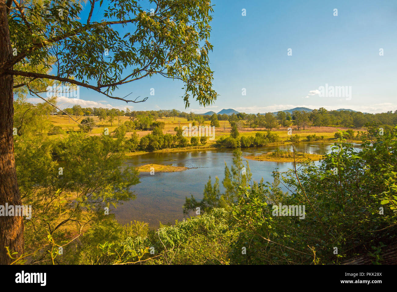 Australian landscape with calm blue waters of Macleay River slicing ...