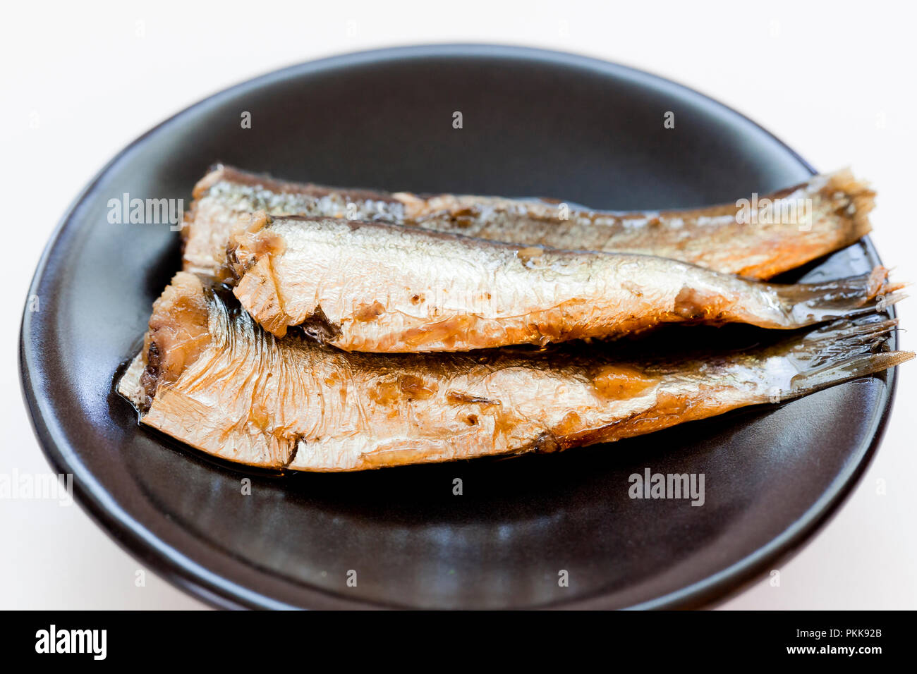 Sardines (aka pilchards) marinated in olive oil on dish - USA Stock ...