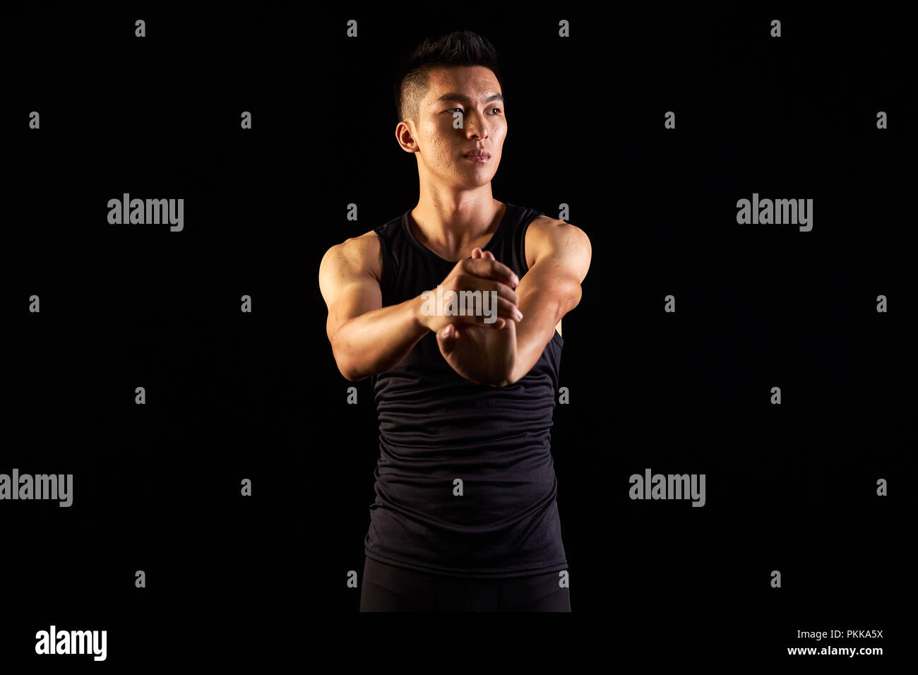 The young men do warm-up exercise Stock Photo - Alamy