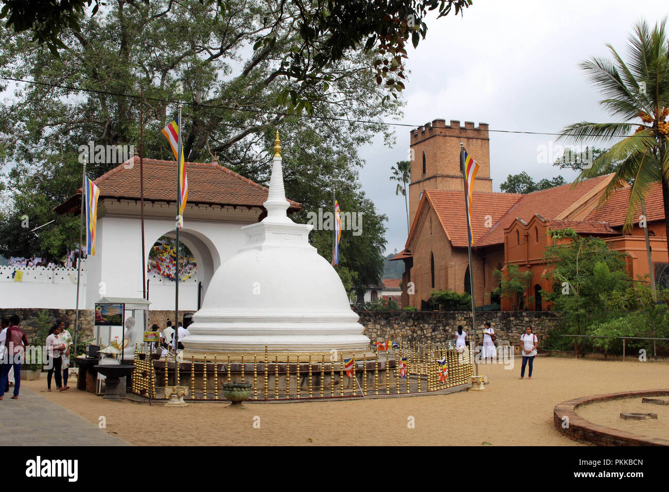 Translation: A white stupa around the Temple of the Sacred Tooth in ...