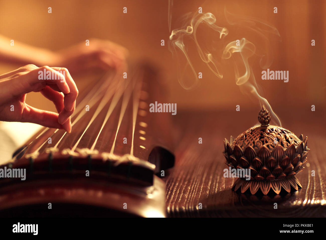 Young woman playing the lyre Stock Photo - Alamy