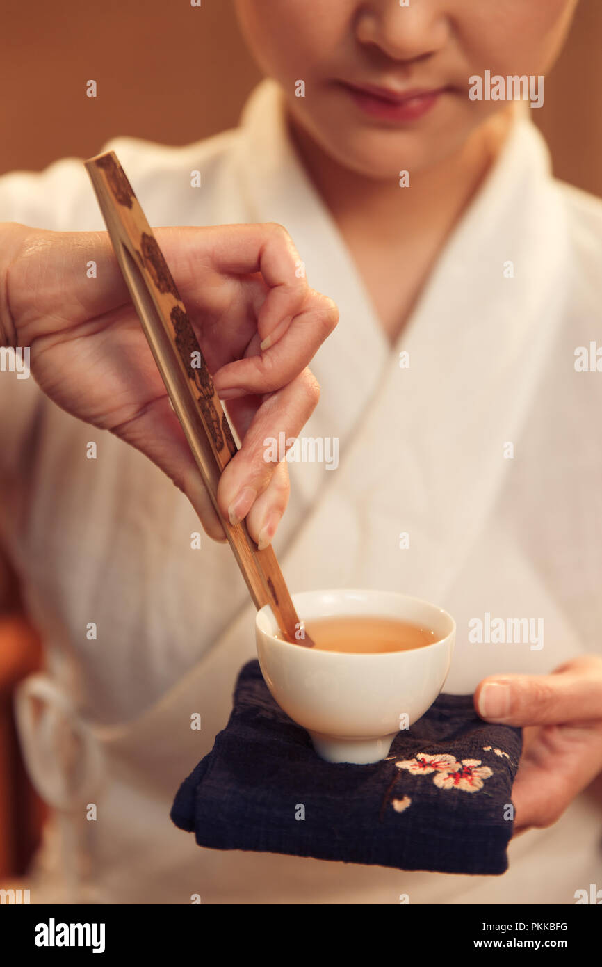 Young women make tea Stock Photo - Alamy