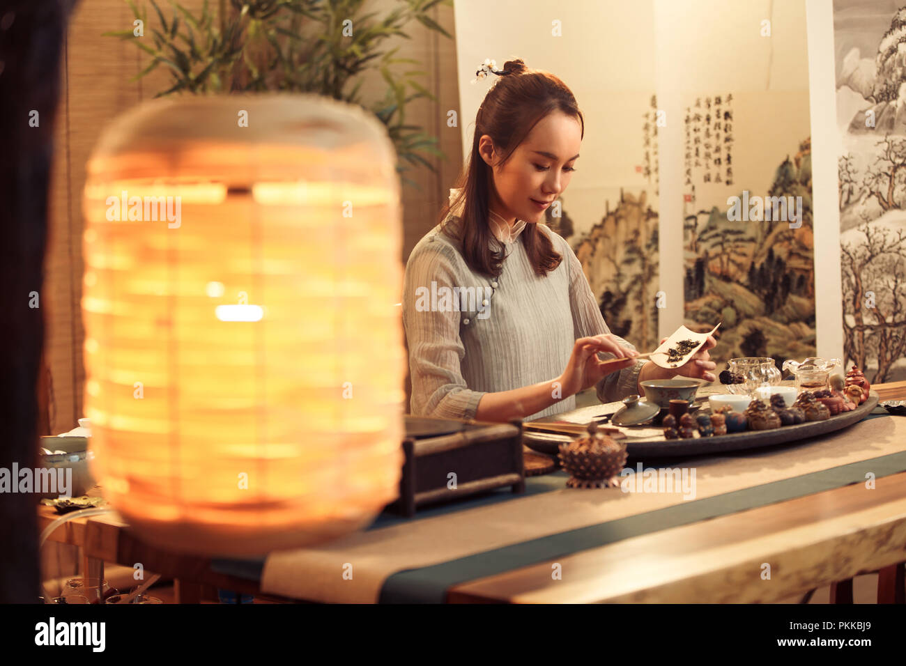 Young women show tea art Stock Photo - Alamy