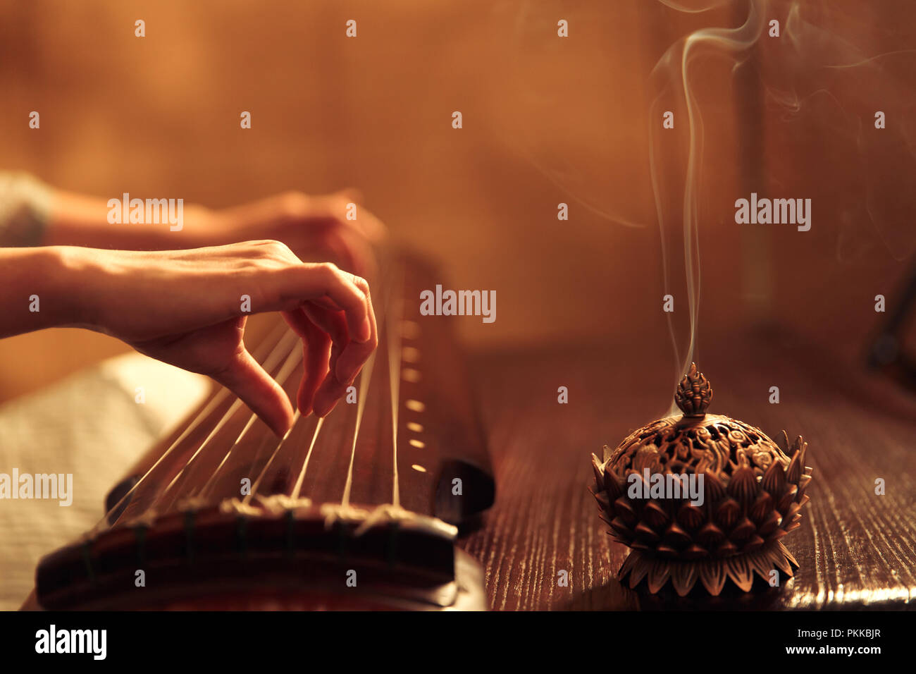 Young woman playing the lyre Stock Photo - Alamy