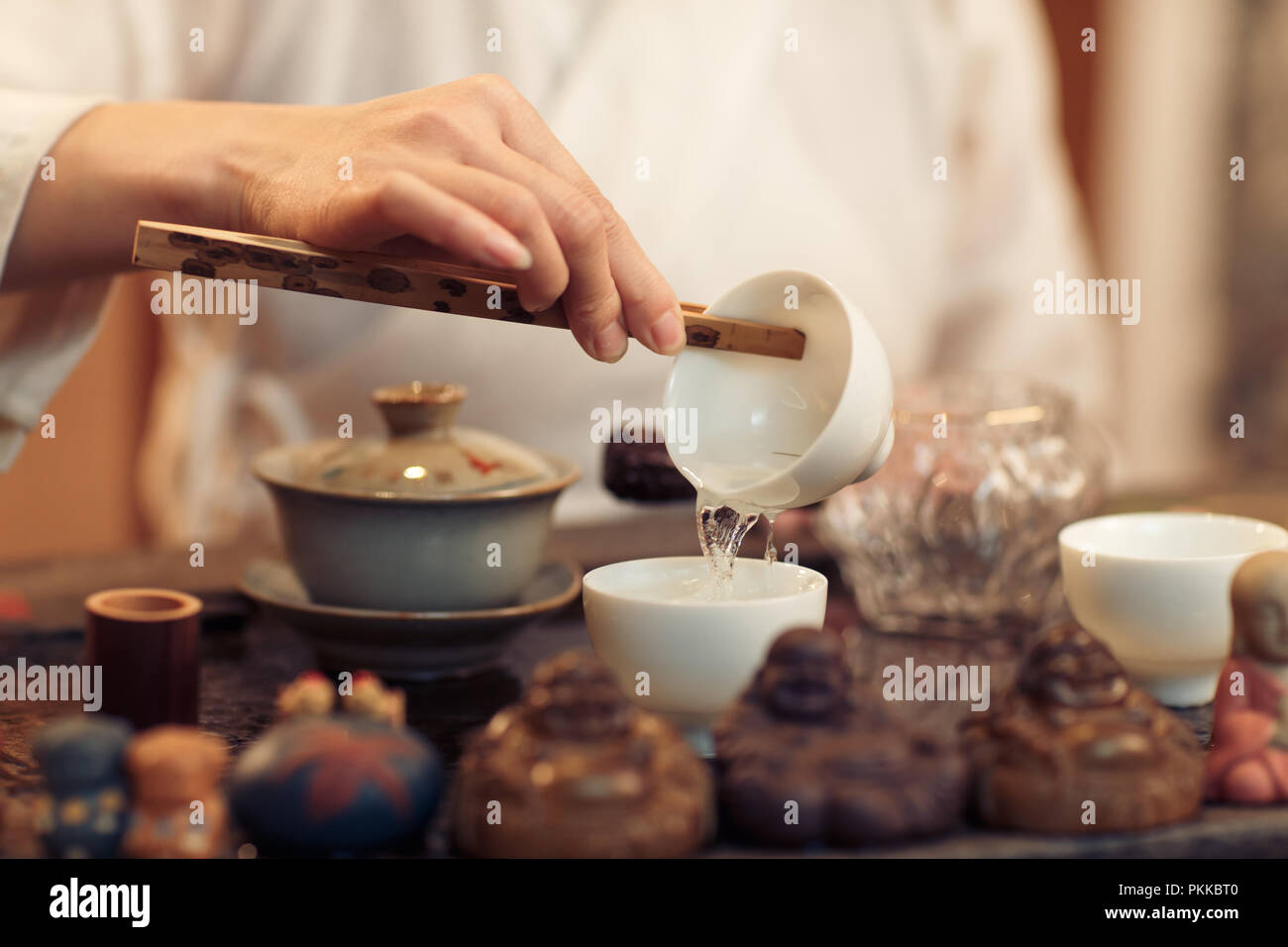Young women make tea Stock Photo - Alamy