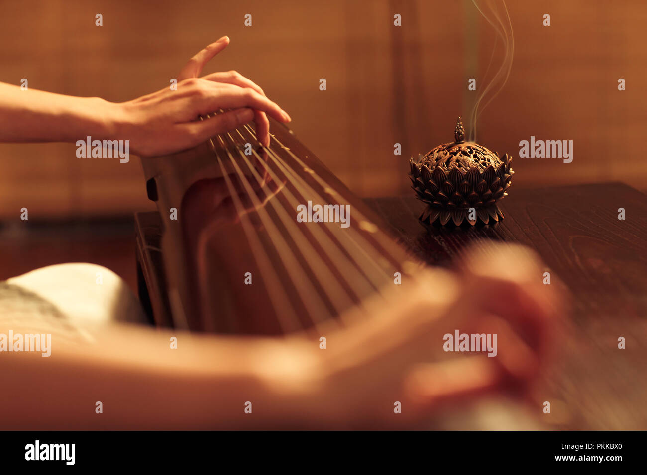 Young woman playing the lyre Stock Photo - Alamy