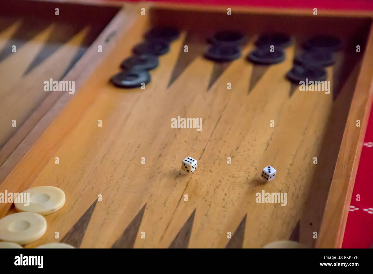 thrown dice on the table while playing backgammon Stock Photo - Alamy