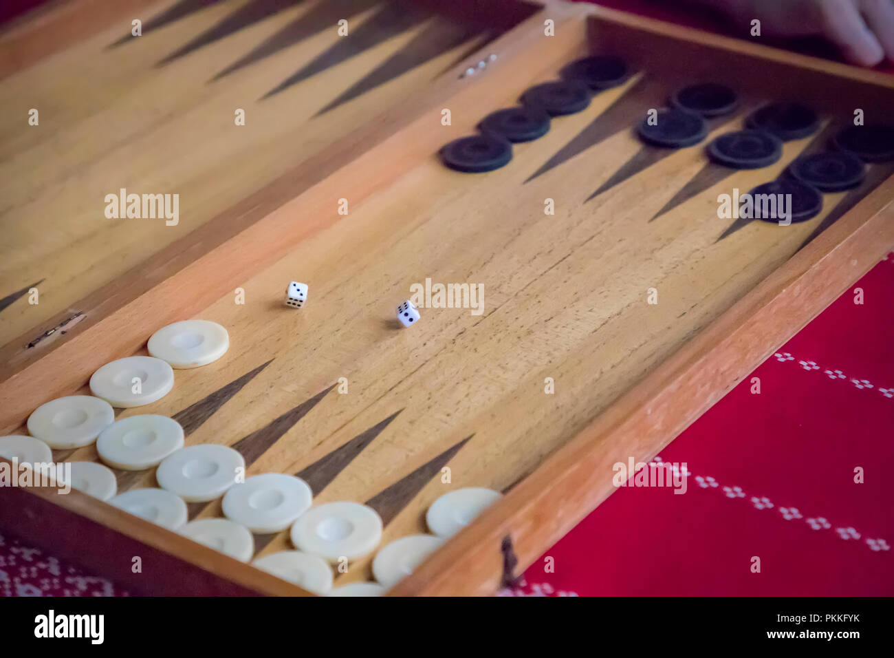 thrown dice on the table while playing backgammon Stock Photo - Alamy