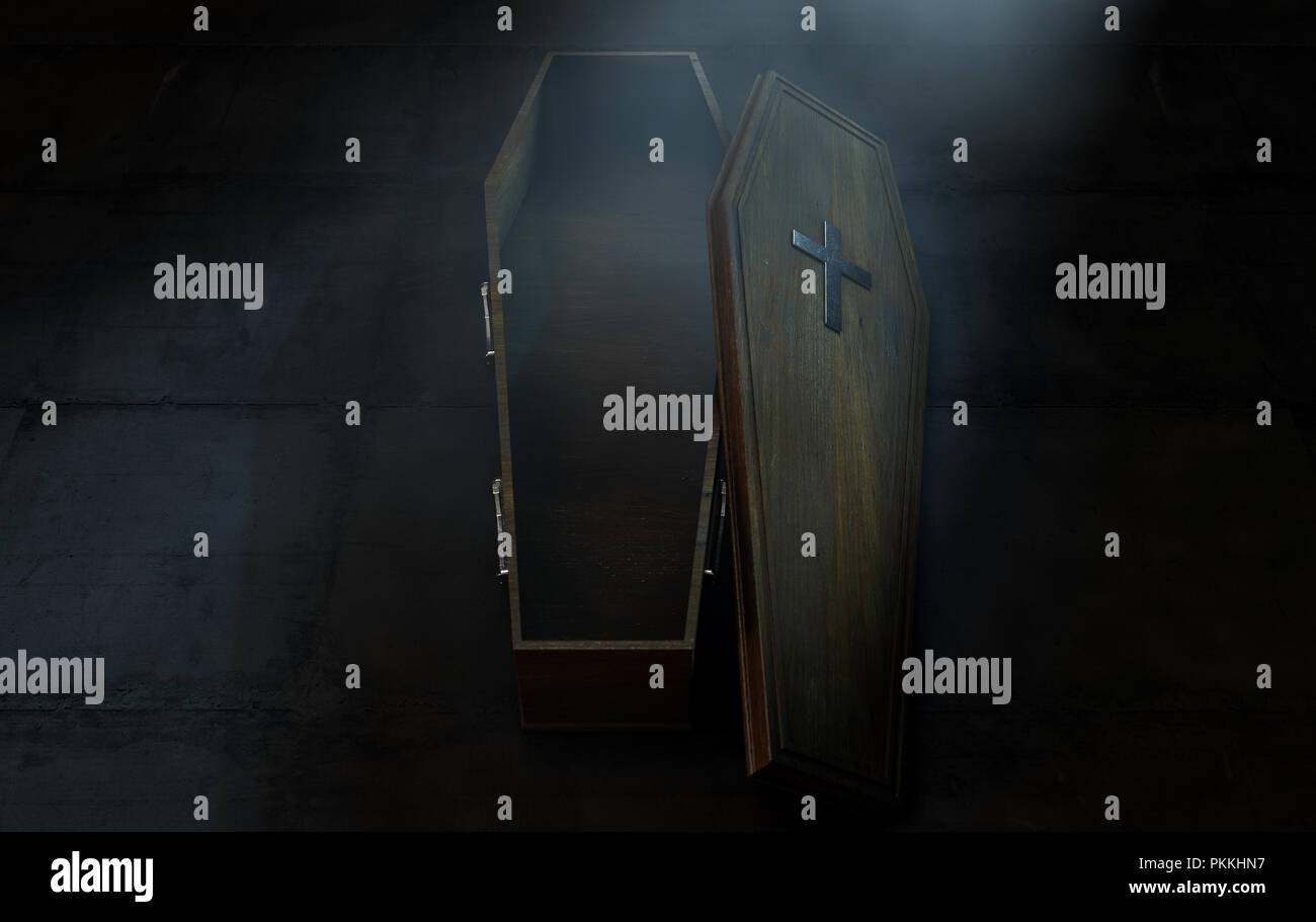 A slightly open empty wooden coffin with a metal crucifix and handles ...