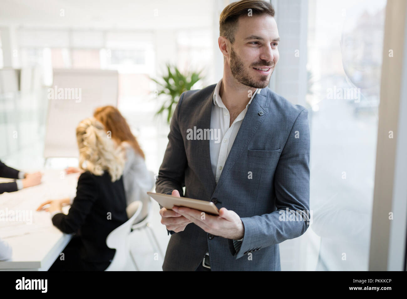 Young smart business people meeting in business office Stock Photo - Alamy
