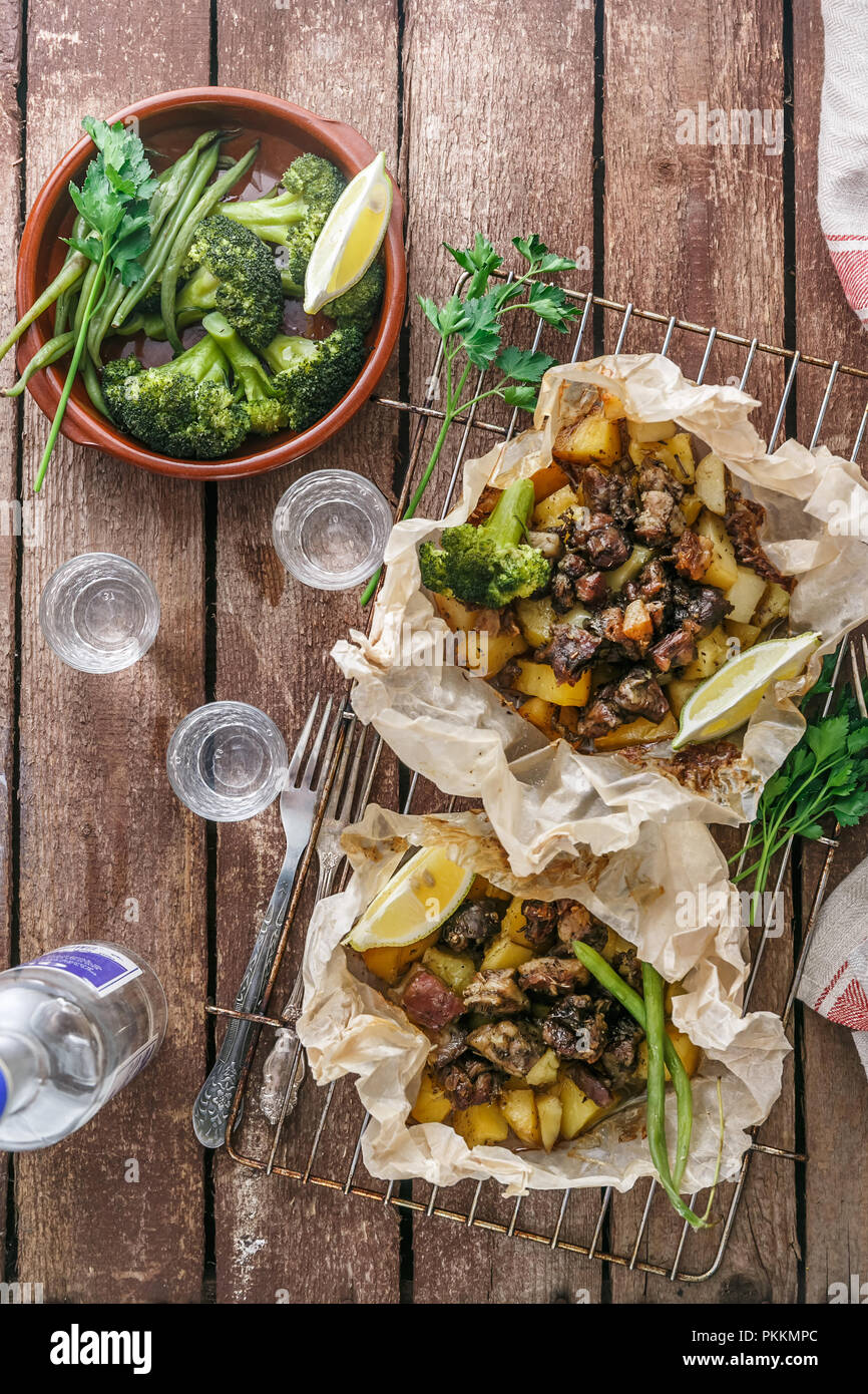 Traditional Greek kleftiko, an oven-baked lamb stew with potato, olive ...