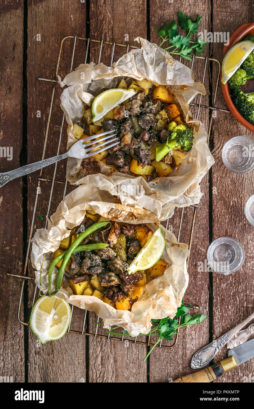 Traditional Greek kleftiko, an oven-baked lamb stew with potato, olive ...