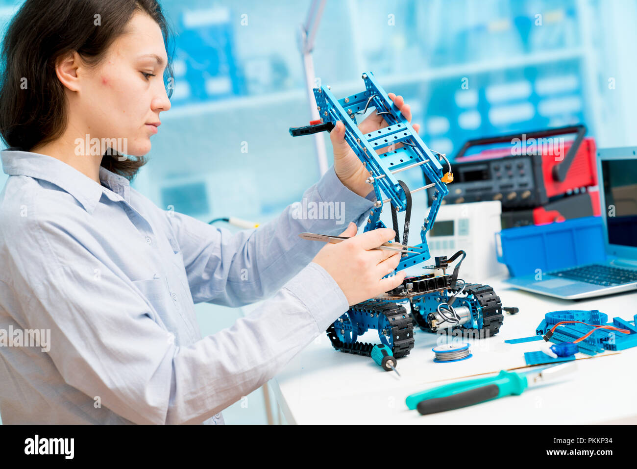 Young woman in CNC and robotics laboratory Stock Photo - Alamy