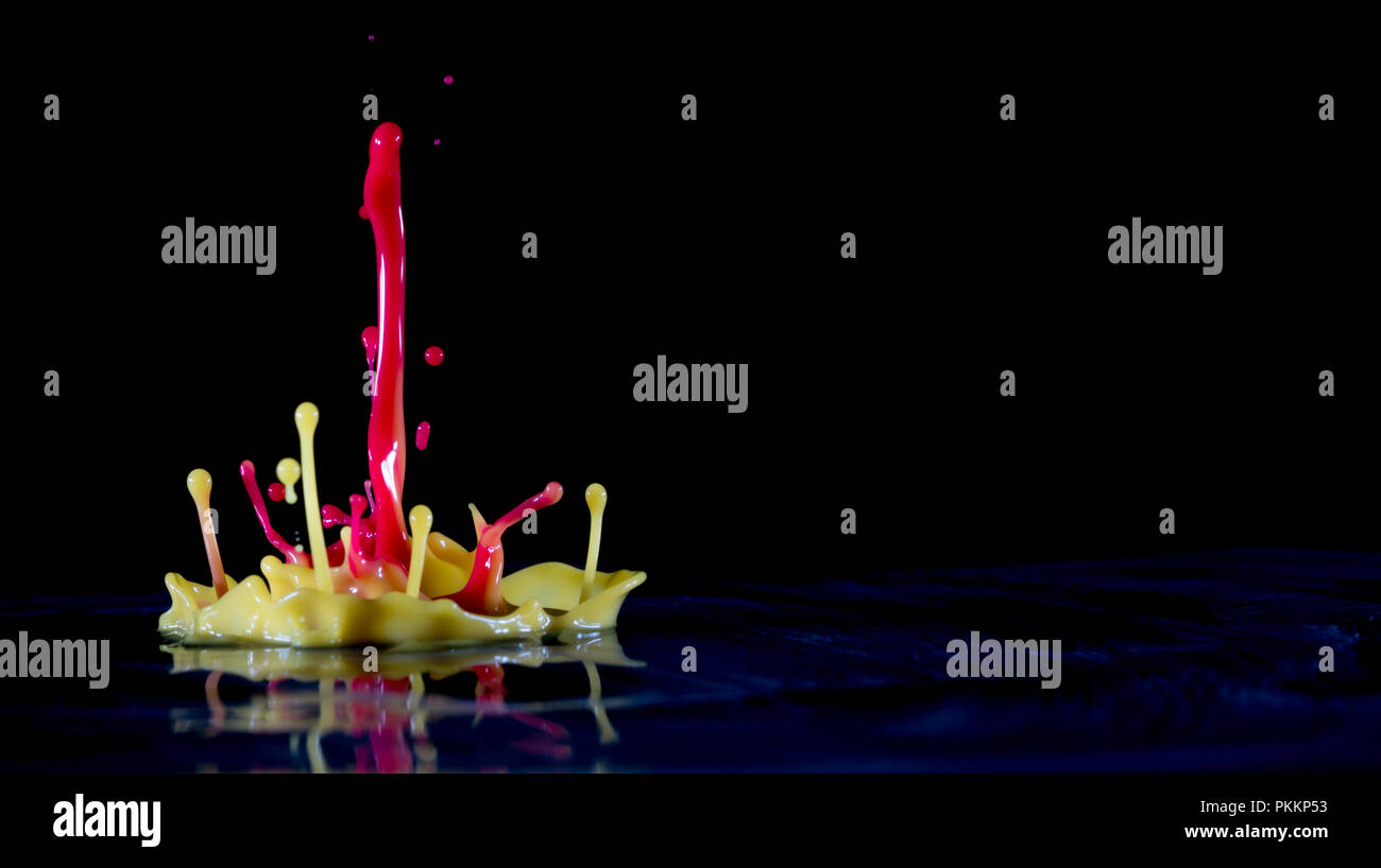 Abstract sculptures of colorful splashes of paint. Dancing liquid on a ...