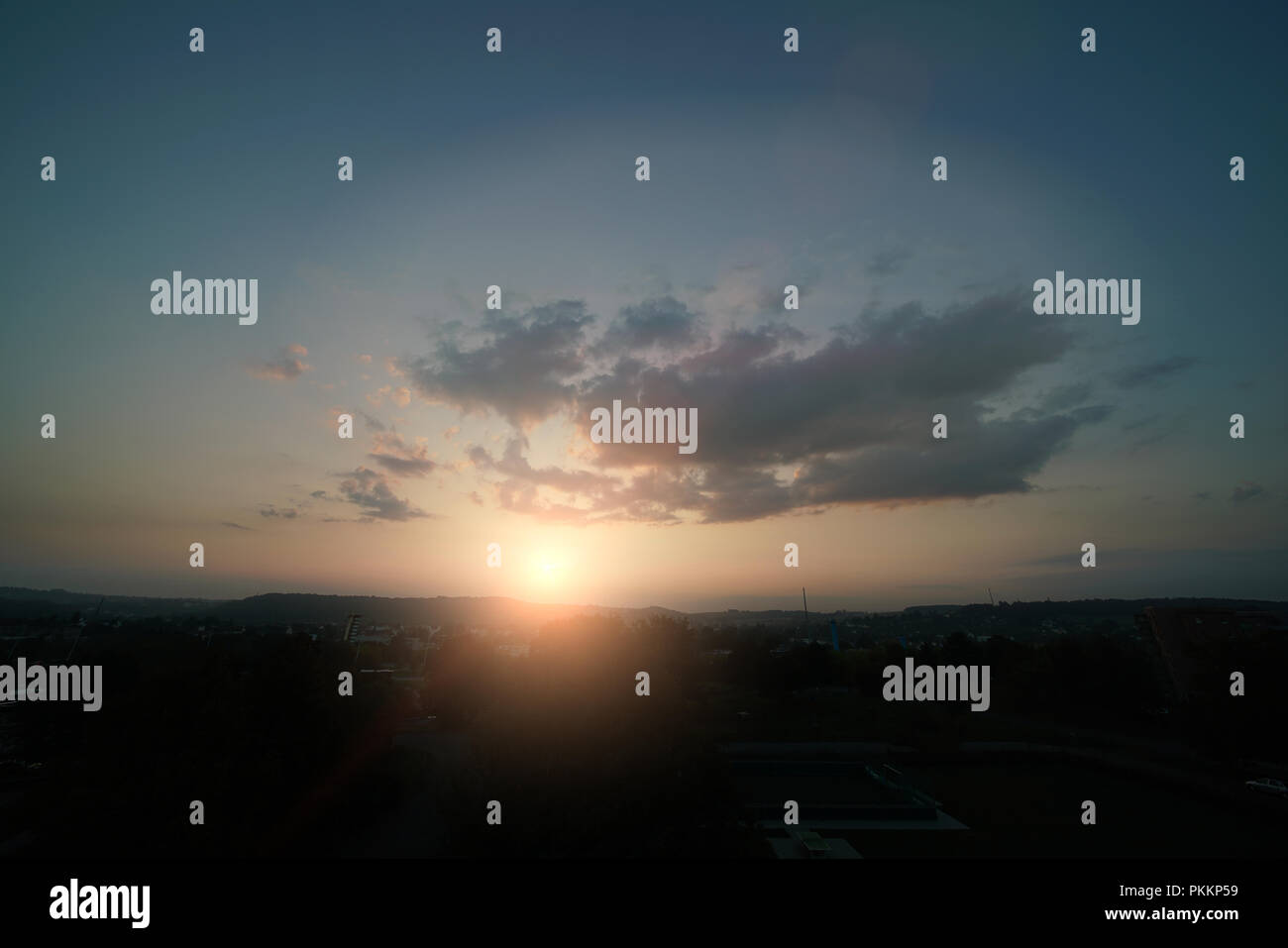 Beautiful sunset sky above clouds with dramatic light Stock Photo - Alamy