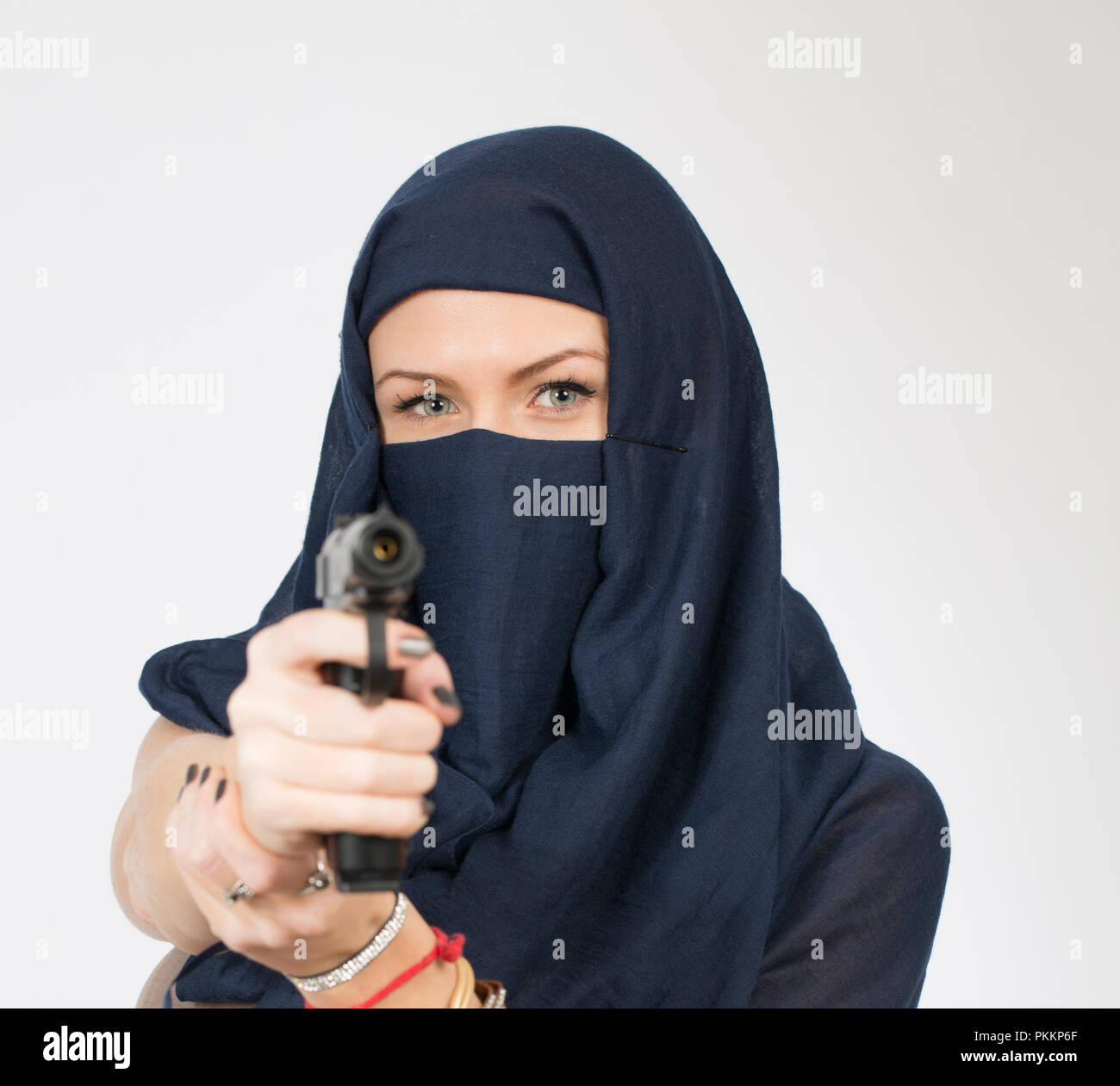 girl in a headscarf with a gun Stock Photo - Alamy