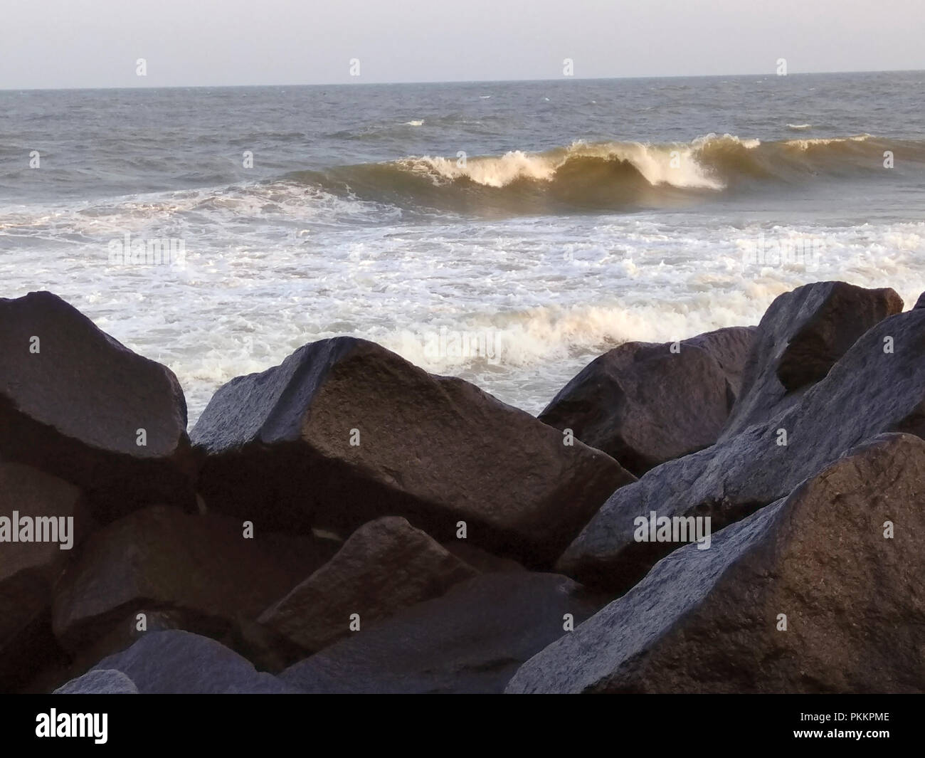 Sea and rocks on promenade of Pondicherry, Tamil Nadu, India Stock ...